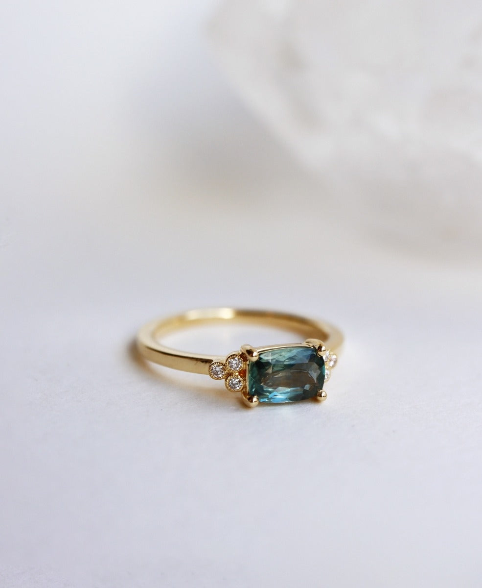 Mon Cheri Engagement Ring - 18k Yellow Gold, Emerald Cut Teal Sapphire | Zoë & Morgan UK